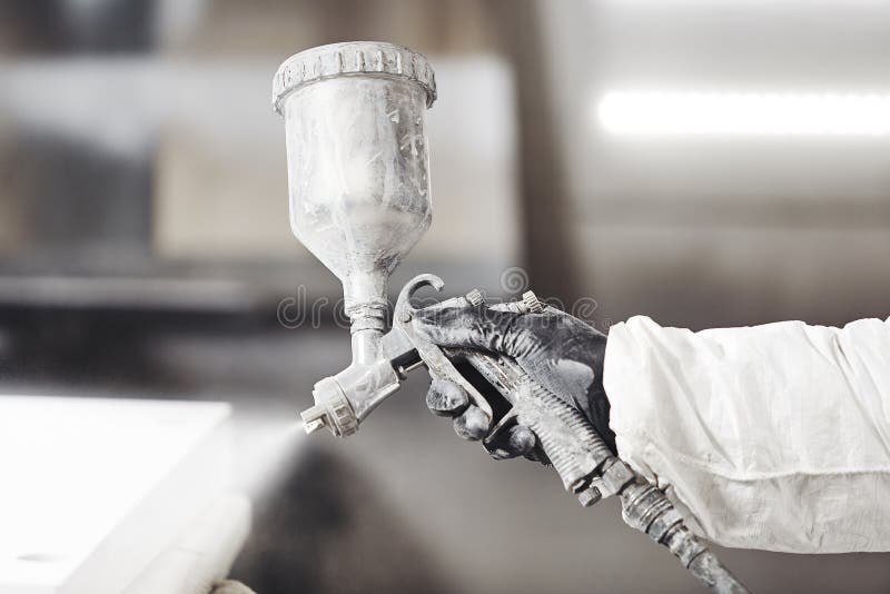 Close-up of Industrial Worker Using Paint Gun or Spray Gun for Applying ...