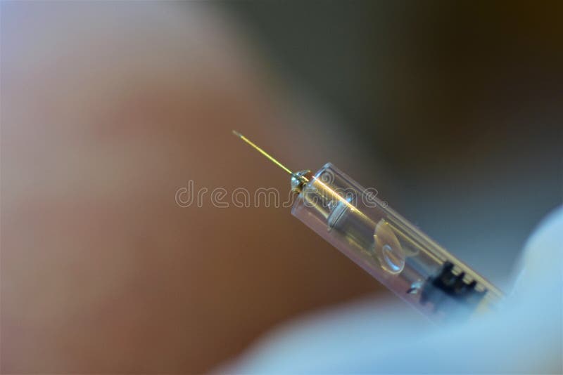 Close Up of an Injection Next To the Skin of an Arm Stock Image - Image ...