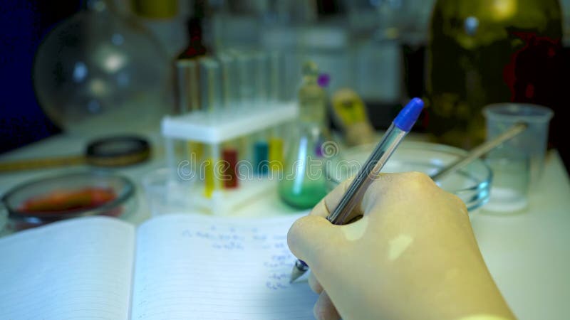 Close-up of the Inspector S Gloved Hand Writing a Test Note on a ...