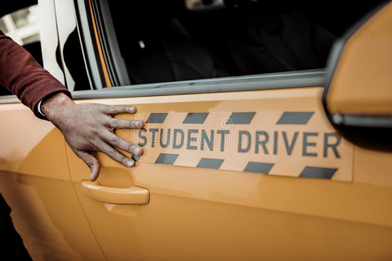 Close Up of Instructor Touching Bright Orange Student Driver Car Stock ...