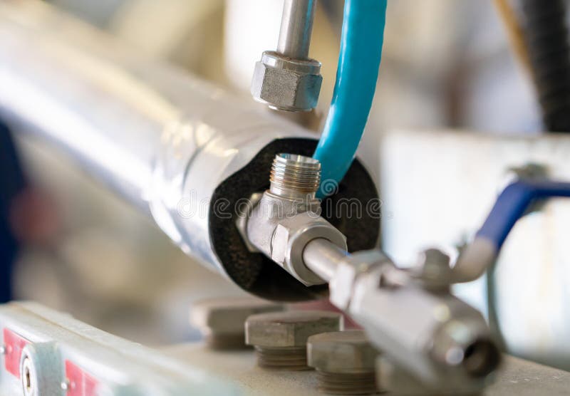 Close-up of Insulated Pipeline System with Connectors and Tubing in ...