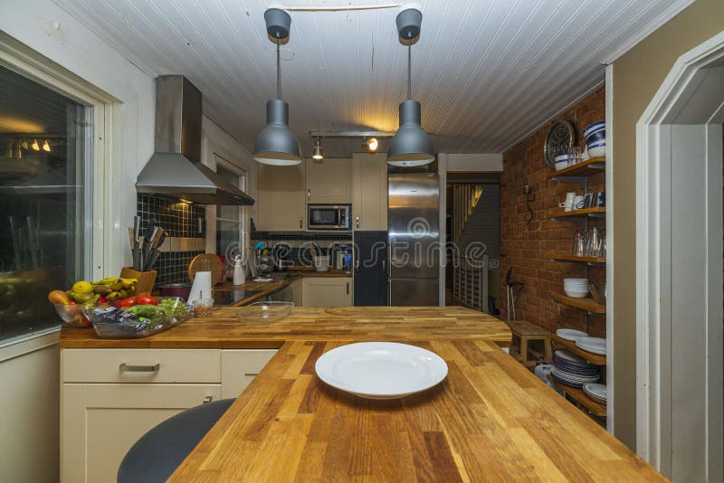 Close Up Interior View of Room with Brick Wall and Kitchen of a Private ...