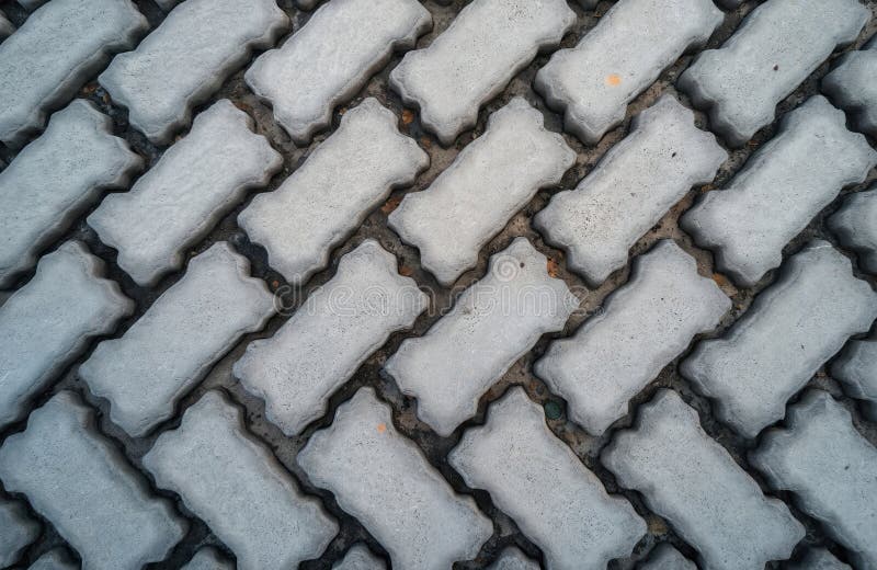 Close Up of Interlocking Grey Concrete Paving Blocks Laid in a Zigzag Pattern. these Strong ...