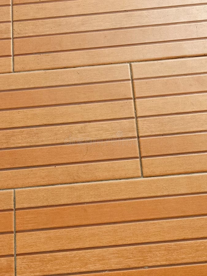 A Close-up of Interlocking Wooden Decking Tiles with a Modern ...