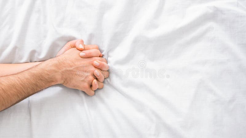 Close Up of Intertwined Hands on White Bedding Stock Image - Image of ...