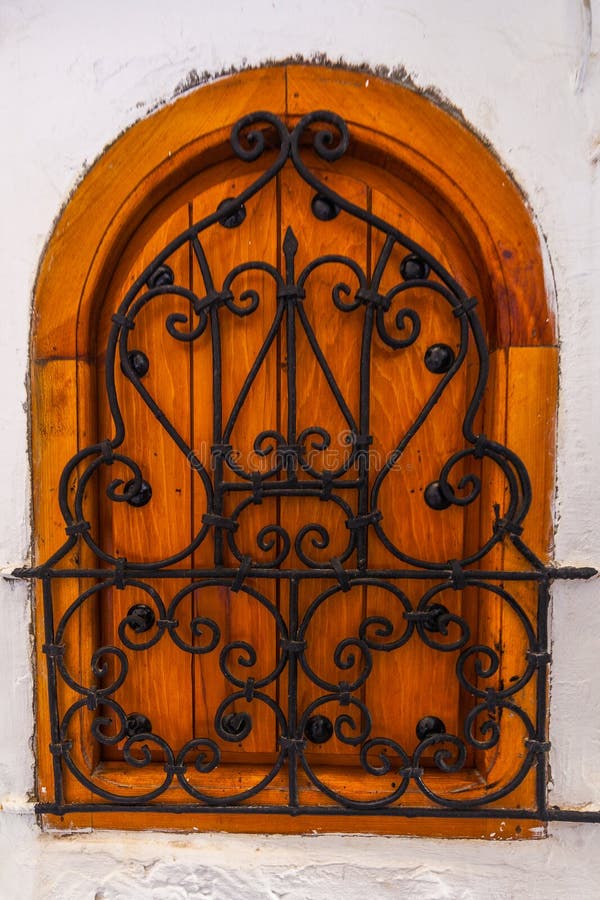 Close-up of an Intricately Wrought Iron Window Grate with Swirling ...