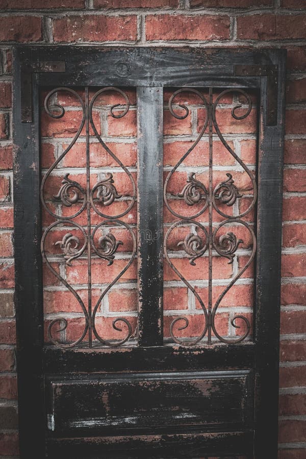 Close-up of Iron Insert with Scroll Design on Reclaimed Painted Door ...