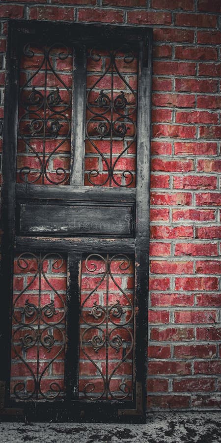 Close-up of Iron Insert with Scroll Design on Reclaimed Painted Door ...