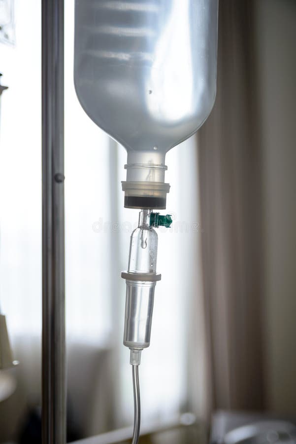 Close Up IV Saline Solution Drip for Patient Stock Photo - Image of ...