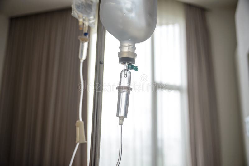 Close Up IV Saline Solution Drip for Patient Stock Photo - Image of ...