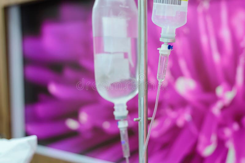 Close Up IV Saline Solution Drip for Patient Stock Photo - Image of ...