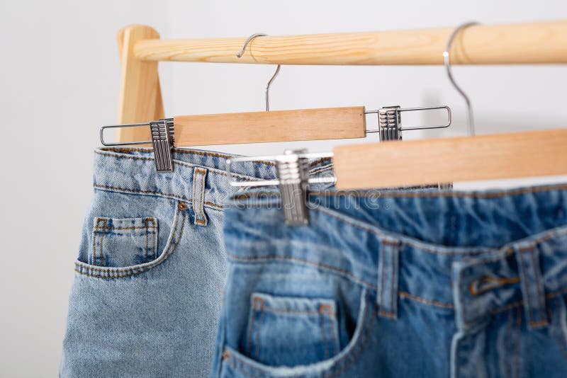 Close-up of Jeans on a Wooden Hanger Stock Photo - Image of style ...