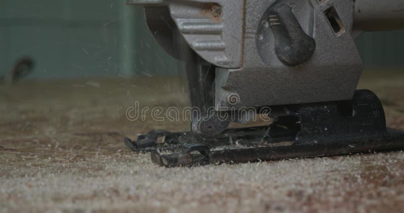 Close-up of a Jigsaw Cutting through Oriented Strand Board, Creating ...