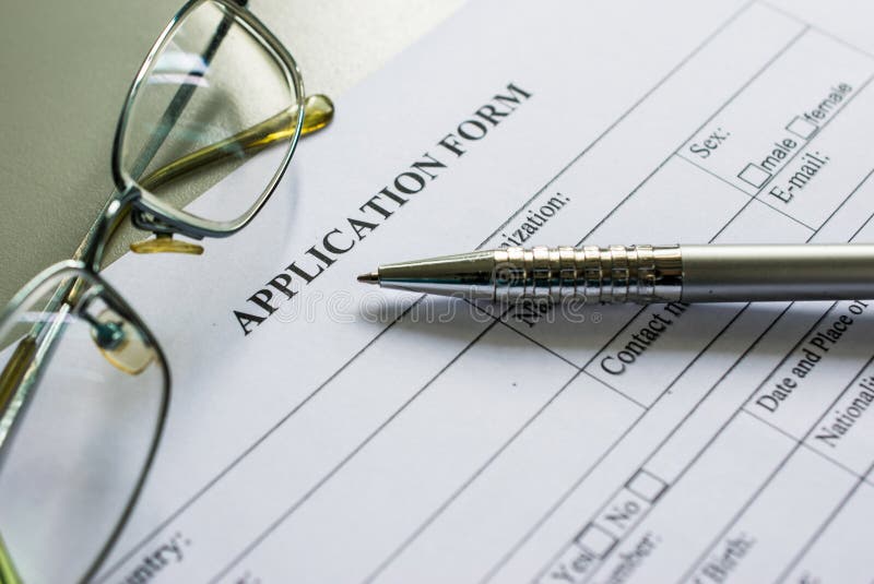 Close Up of a Job Application Form on Desk with Pen and Glasses Stock ...