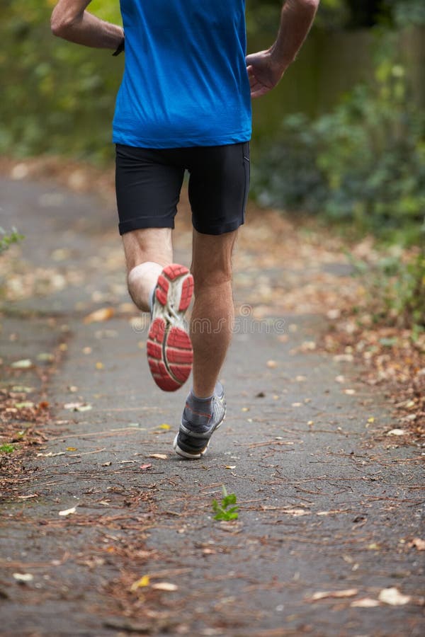 Close Up of Jogger S Feet Running on Path Stock Photo - Image of jogger ...