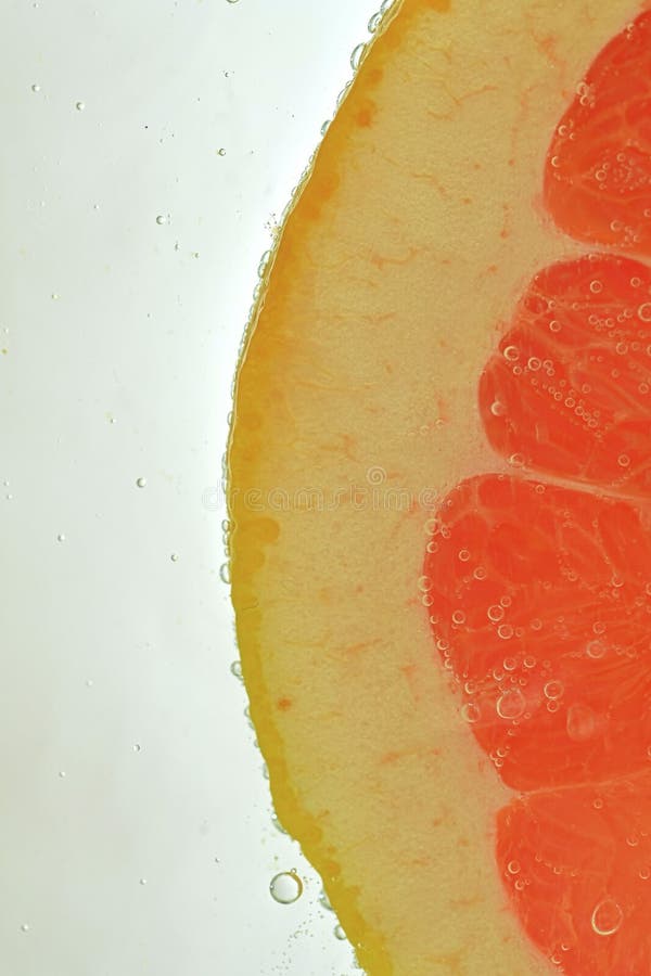 Close-up of Juicy Grapefruit Slice on White Background. Slice of Red ...