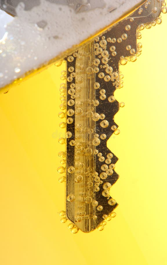 Close up key in beer stock photo. Image of glass, beer - 23674508