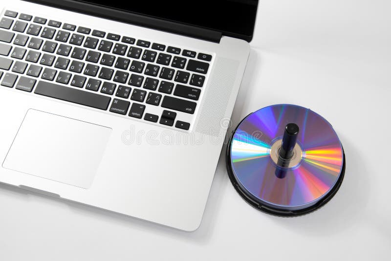 Close Up Keyboard Computer with Cd on White. Editorial Stock Photo ...