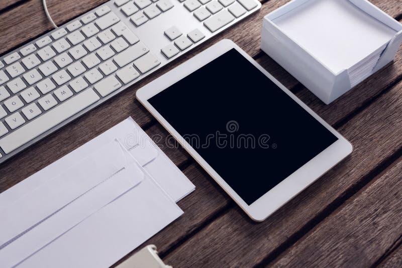 Keyboard, Digital Tablet, Envelope and Box on Wooden Table Stock Photo ...