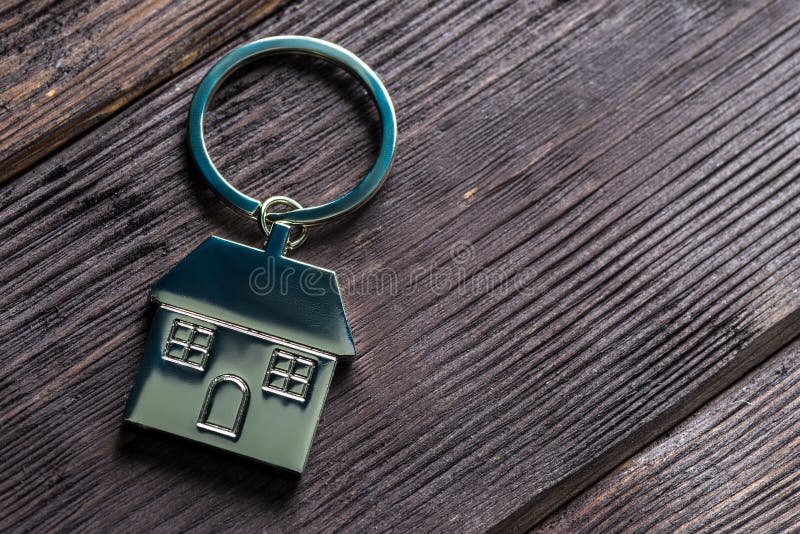 Keychain in the Shape of a House with a Key in the Hands of a Person ...