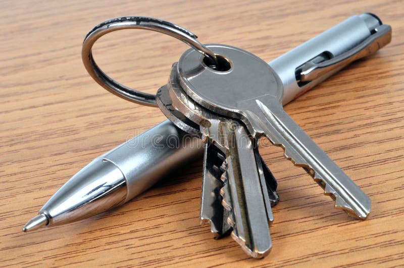 Bunch of keys on a pen stock photo. Image of table, keys - 141883026