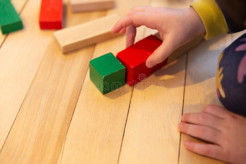 Close Up of a Kid Hand Playing with Colourful Blocks Stock Photo ...