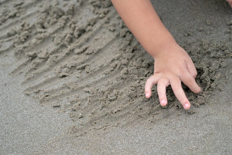 Close Up Kid`s Hand and Fingers, Play and Learn at the Beach Stock ...