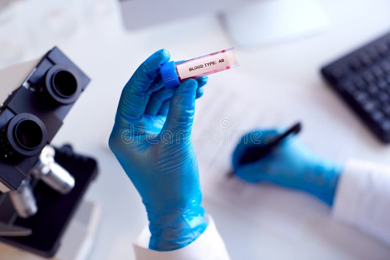 Close Up of Lab Worker Conducting Research Using Microscope Holding ...