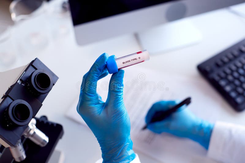 Close Up of Lab Worker Conducting Research Using Microscope Holding ...