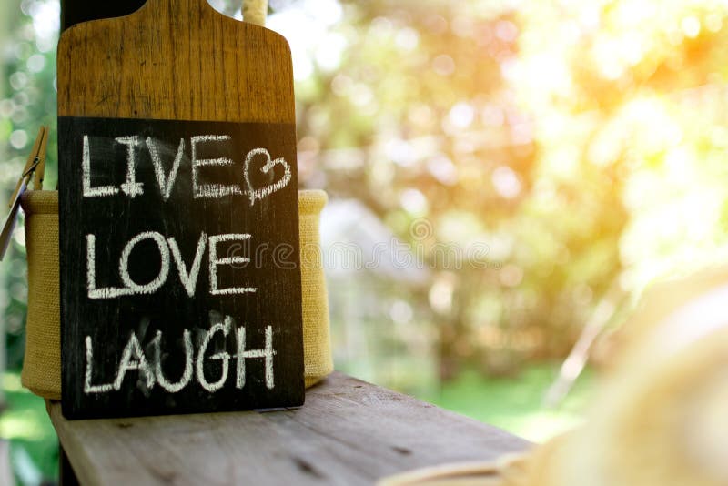 Close Up Label `LIVE LOVE LAUGH` Stock Image - Image of eating, light ...