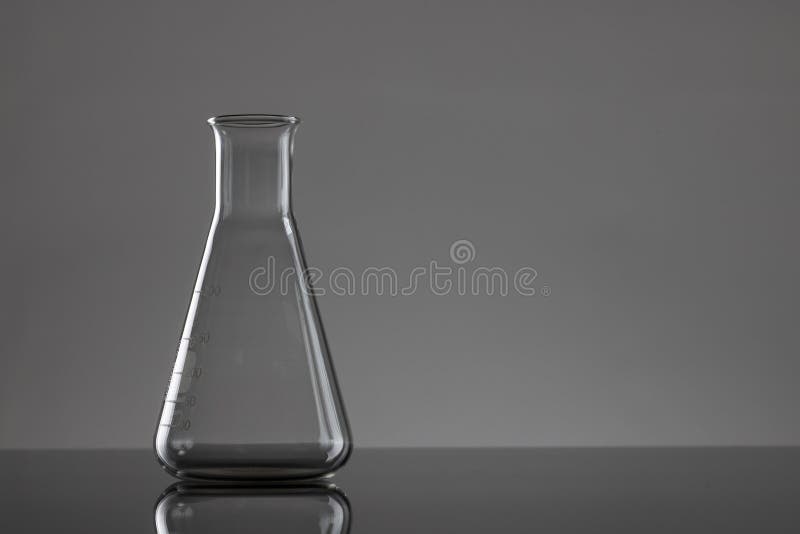 Close Up of Laboratory Beaker and Copy Space on Grey Background Stock ...