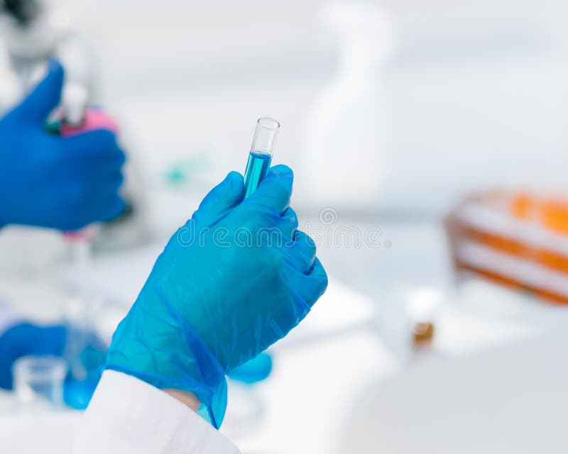 Close Up. Laboratory Workers with Test Tubes Sitting at the Laboratory ...
