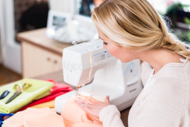Woman doing tailoring work stock photo. Image of appliance - 160000572