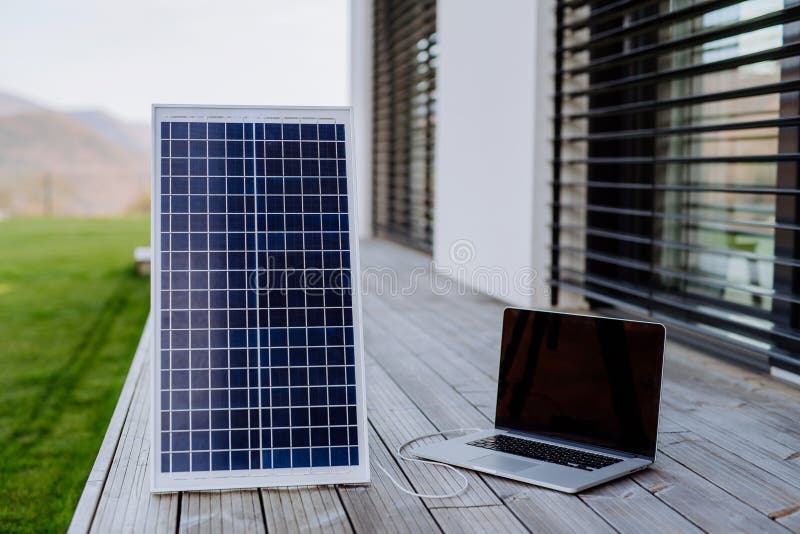 Close-up of Laptop Charging Trough Solar Panel. Stock Image - Image of ...