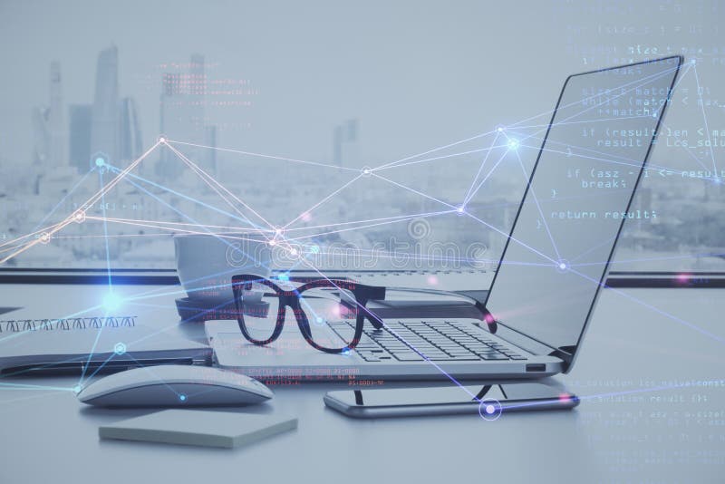 Close Up of Laptop Computer and Other Items on Desktop with Abstract ...