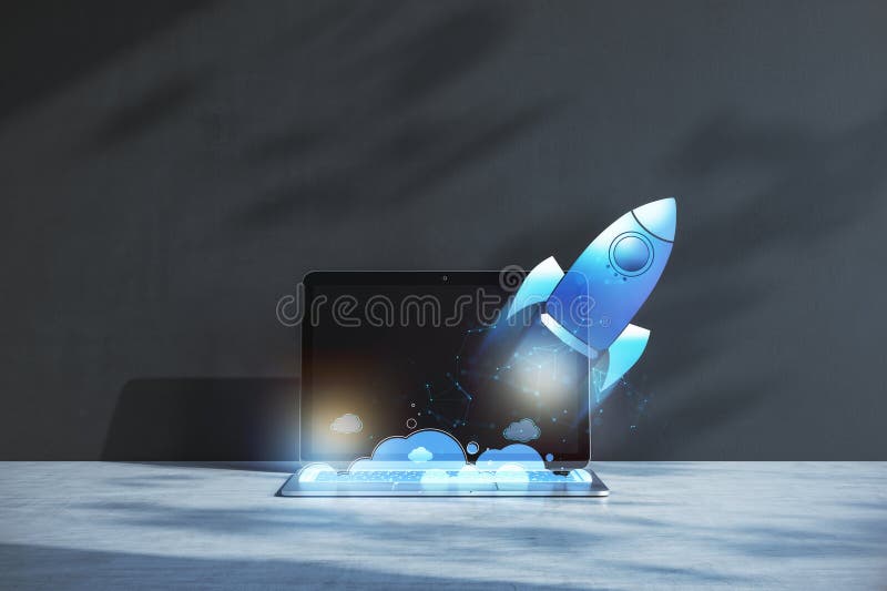 Close Up of Laptop at Workplace with Glowing Flying Blue Rocket on ...