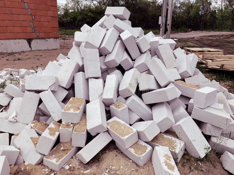 Close Up of Large Pile of White Bricks on Ground. Building Materials on ...