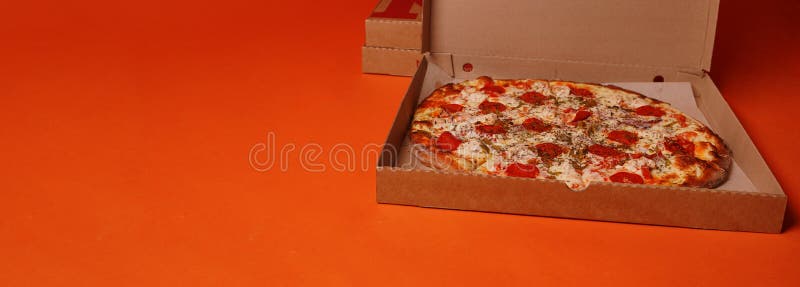 Close Up of Large Pizza in Box on Orange Background. Appetizing Pizza ...