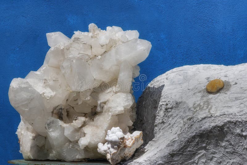 Close Up of a Large White Quartz Rock with a Blue Background Stock ...
