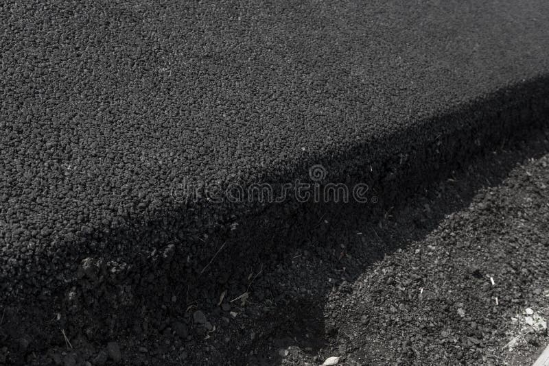 Close-up on a Layer of New Asphalt at the Road Under Construction ...