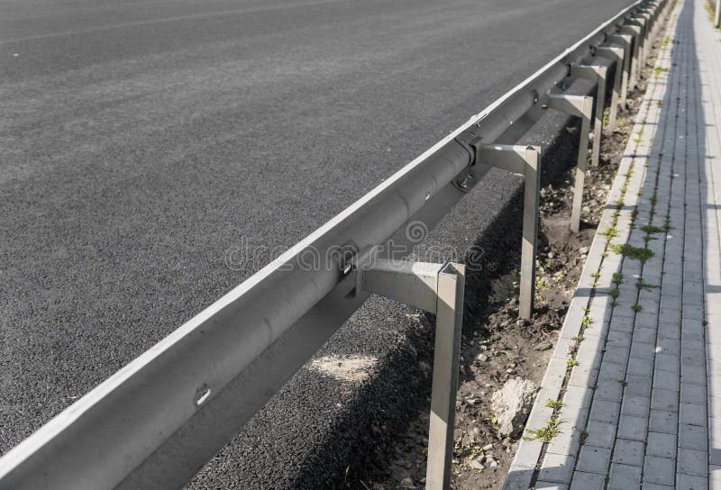 Close-up on a Layer of New Asphalt at the Road Under Construction with ...