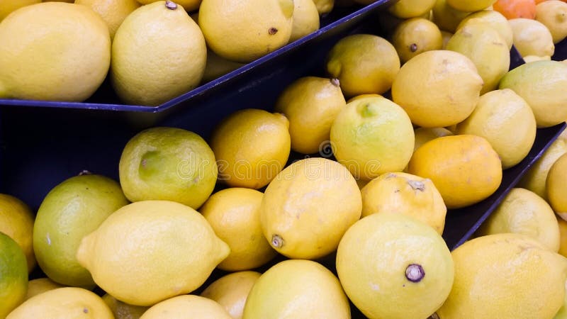 Lemon in display at market stock photo. Image of collection - 114542664