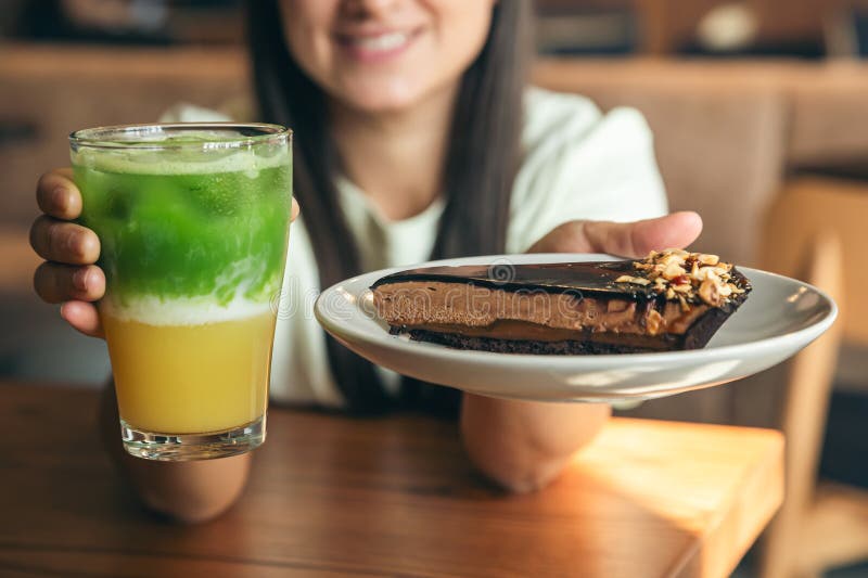 Close-up, Lemonade and Chocolate Cake in Female Hands. Stock Photo ...