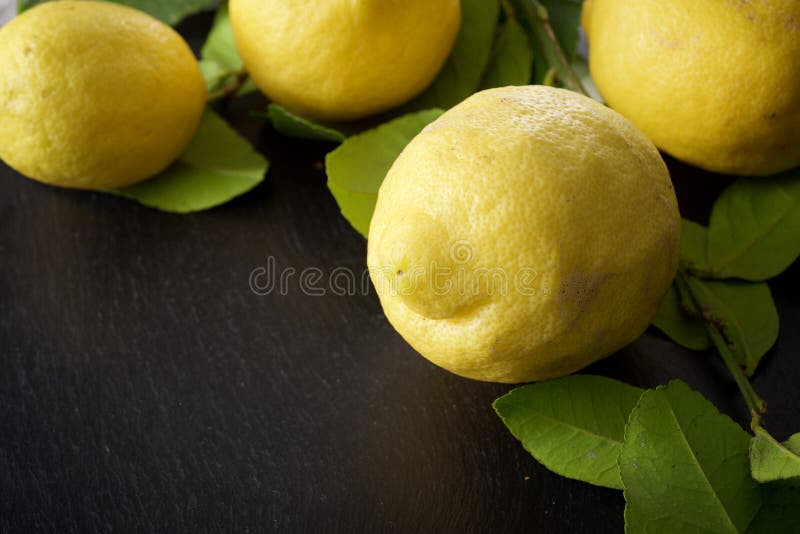 Close-up of Lemons on a Slate Surface Stock Photo - Image of leaf ...