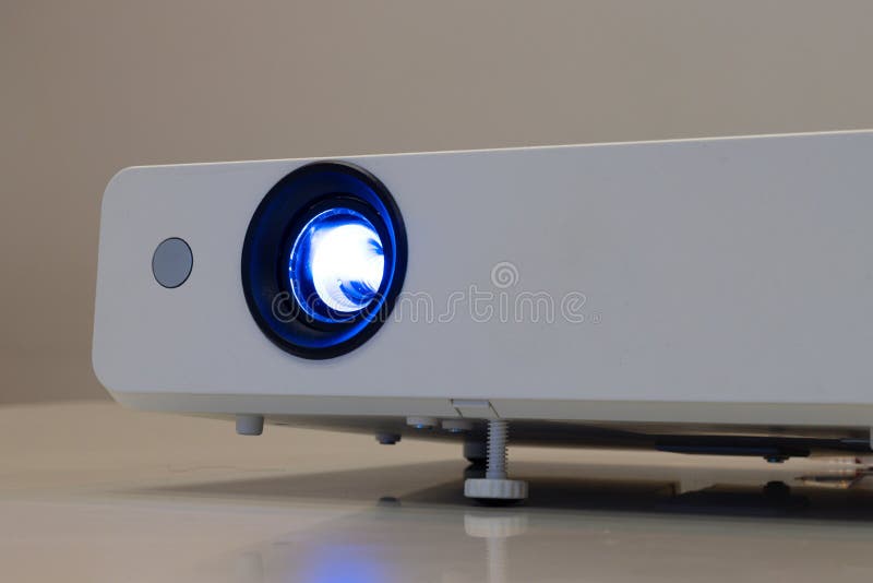 Close Up the Lens of the Projector with Light for Presentation in a ...