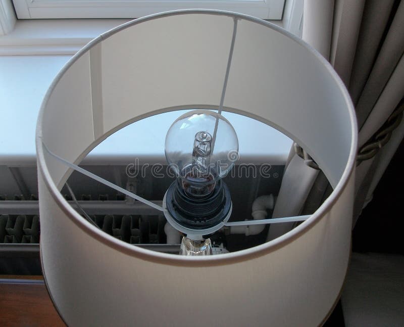 The Close Up of Light Bulb Inside Hotel Table Lamp. Stock Image - Image ...