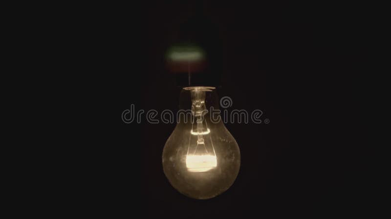 Close Up of Light Bulb Turns on and Off. Footage. Blinking Old ...