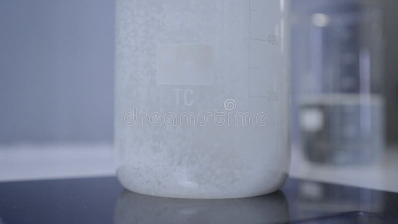 Close-up of Liquid in Laboratory Beaker Stock Video - Video of research ...