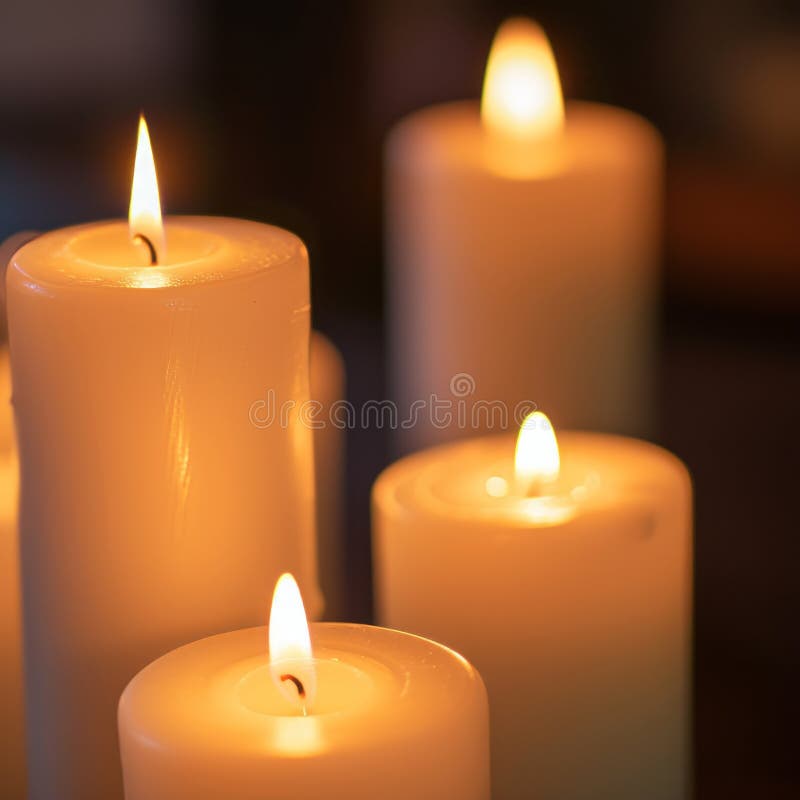 Close-up of Lit White Candles Glowing Warmly Against a Dark Background ...