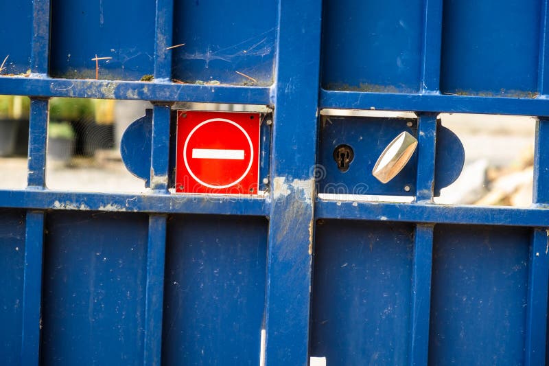 Locked Blue Gate with Gold Spear Tips Stock Photo - Image of cage ...